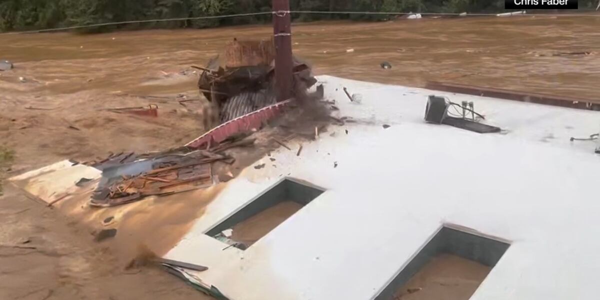 Man captures video as building caught in floodwaters gets ripped in ... Man captures video as building caught in floodwaters gets ripped in ...